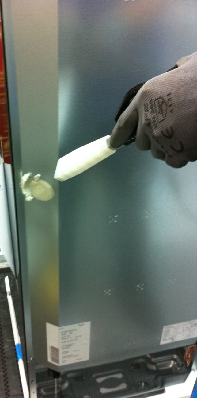 Refrigerator manufacturer reduces scrap with dry ice